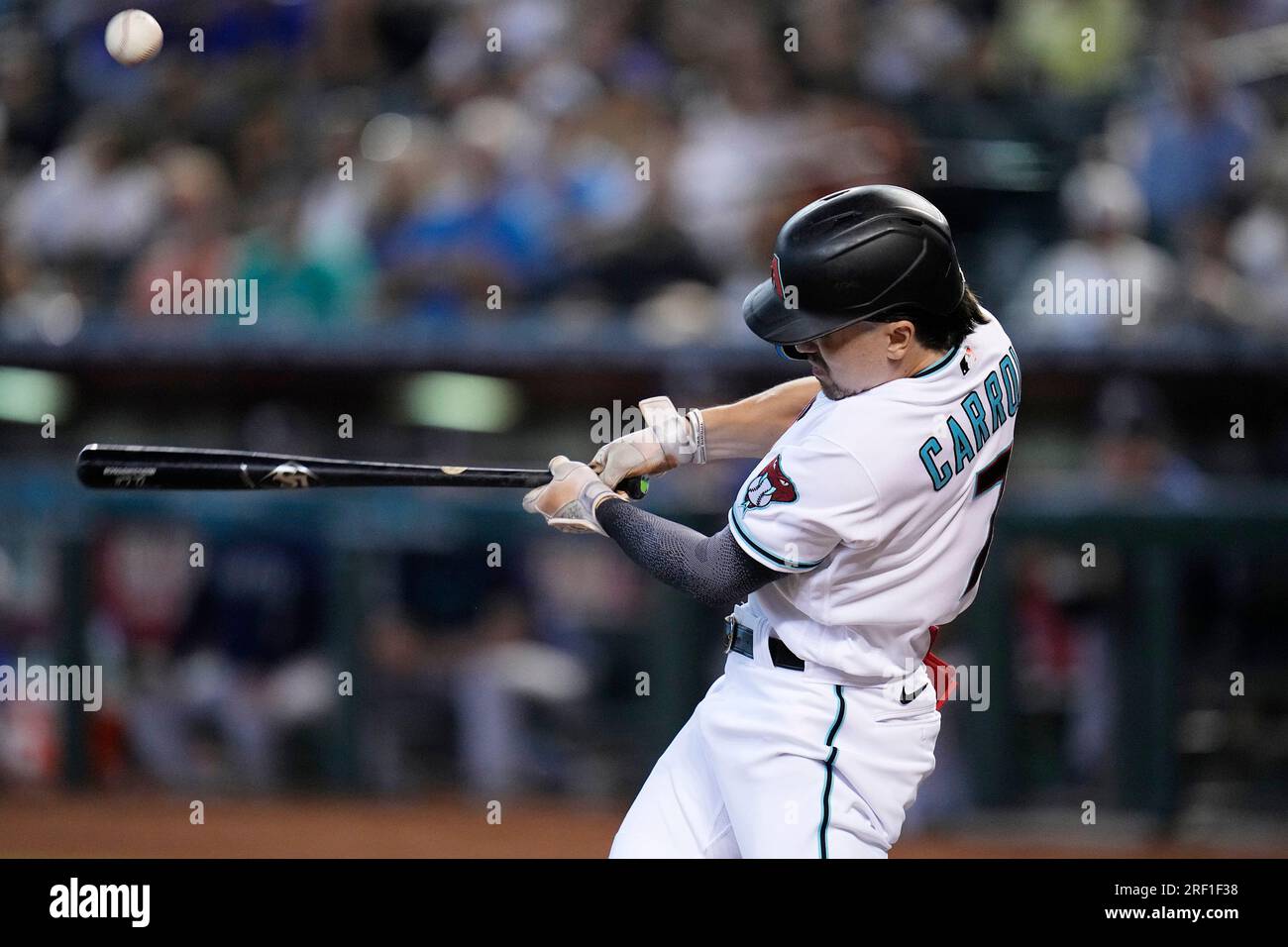 Arizona Diamondbacks' Corbin Carroll fouls off a pitch against the Seattle Mariners during the ...