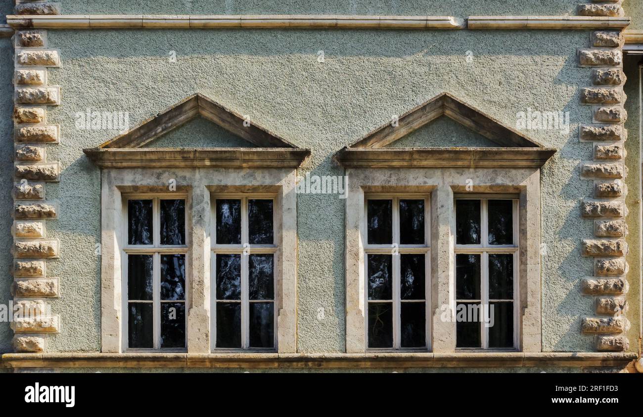 retro windows on the grunge facade. traditional old european ...