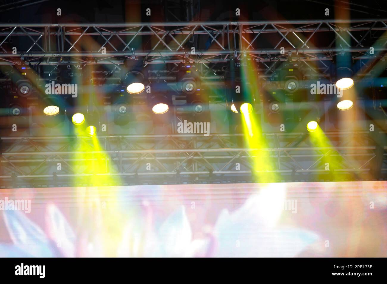 Beams of yellow light from stage modern equipment Stock Photo - Alamy