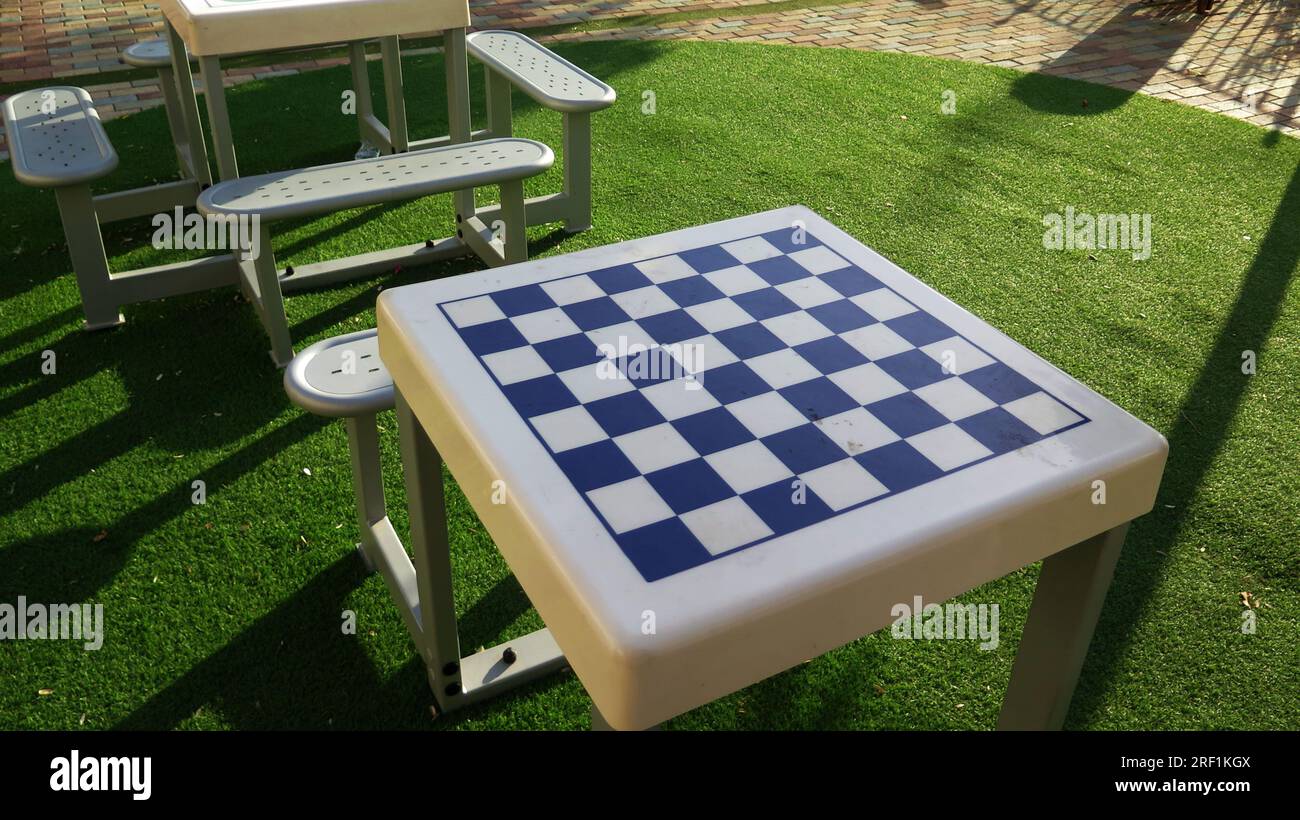 Games tables at children park in Andalusian village Stock Photo - Alamy
