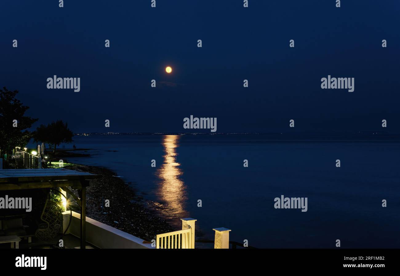 night seascape with full moon and moonlight on dark sky Stock Photo - Alamy