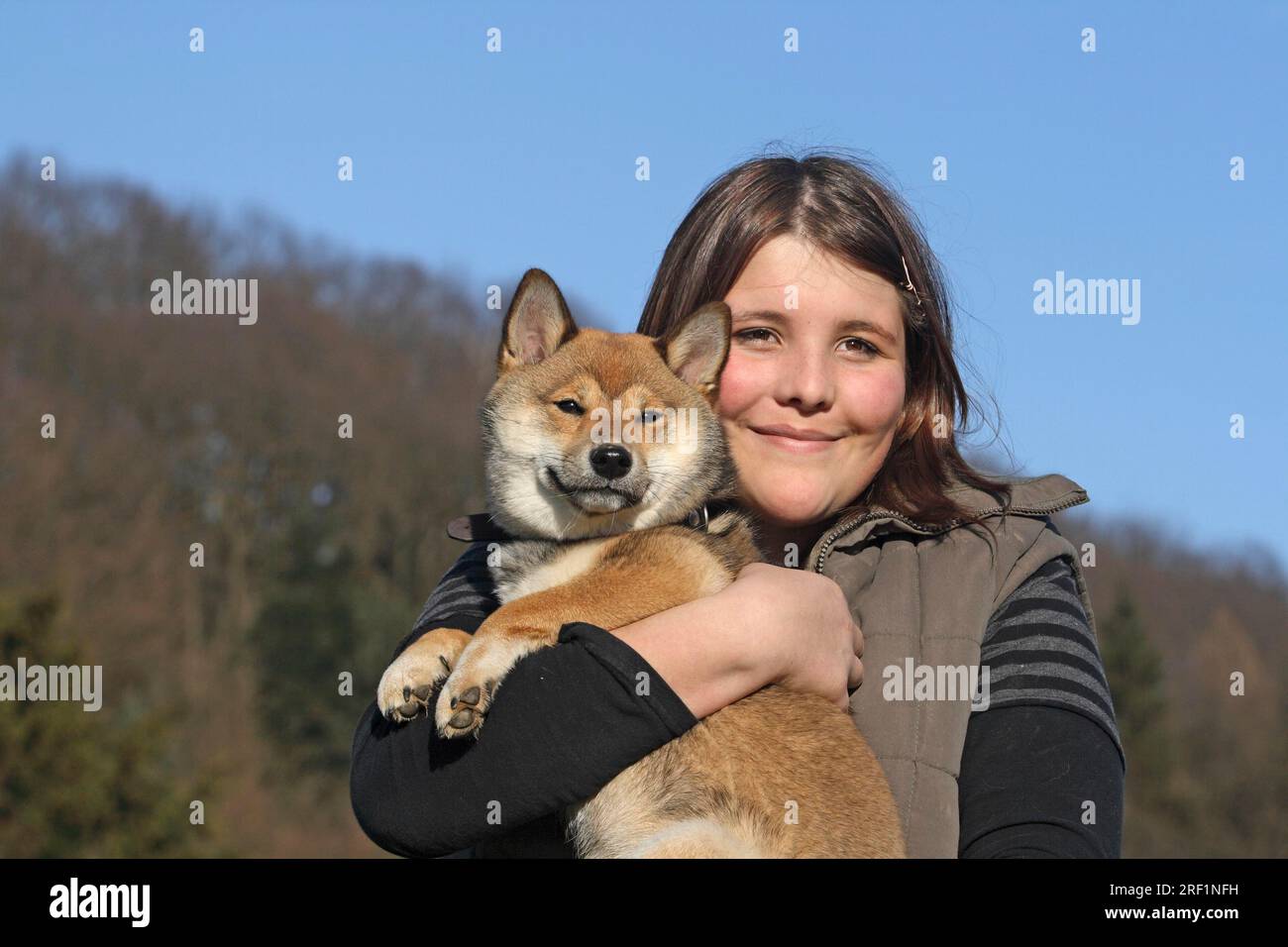 Girl holding Shiba Inu in her arms Further motifs on this theme are ...