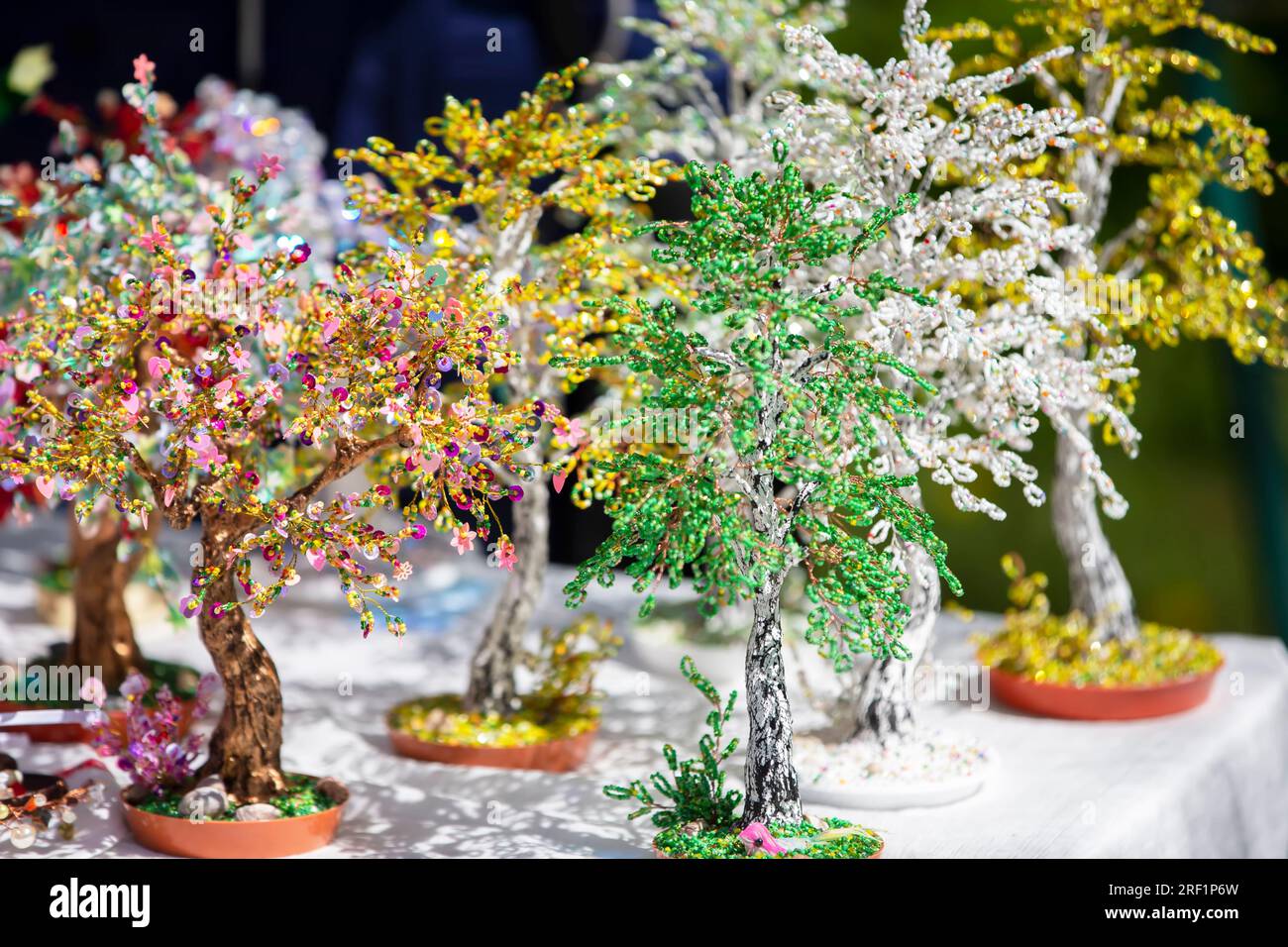 Handcrafted beaded trees for sale at the handicraft fair Stock Photo - Alamy