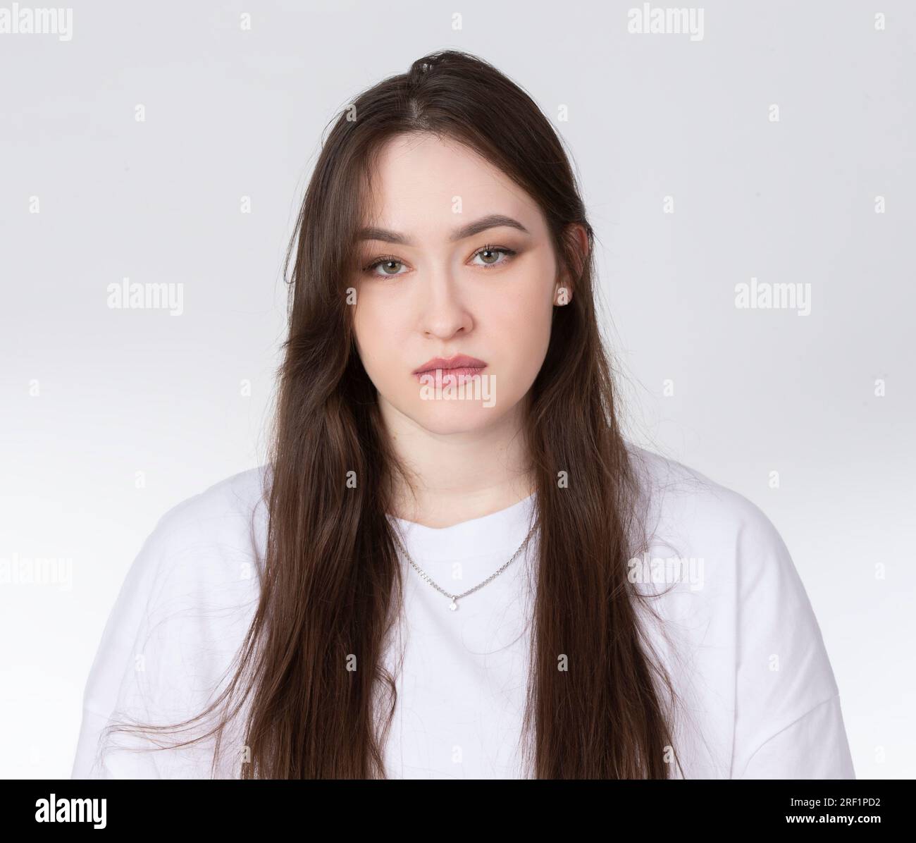 Portrait of a young beautiful Slavic girl with green eyes and long hair ...