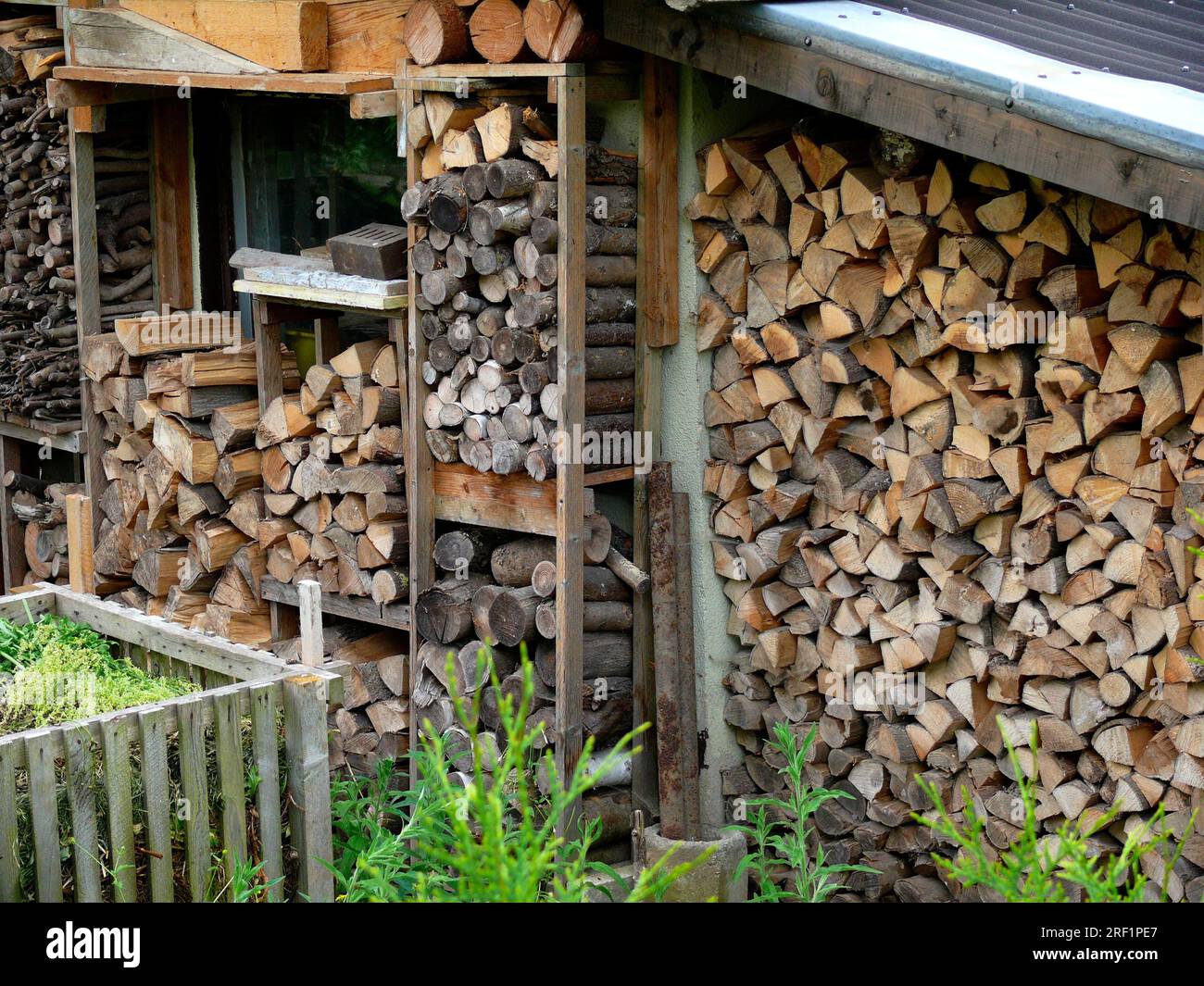 Wood pile behind the house Stock Photo - Alamy