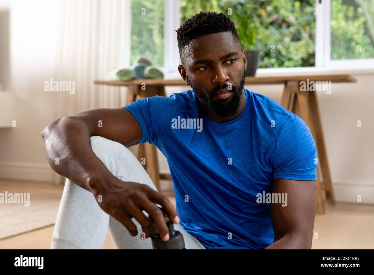 Man sitting on mat hi-res stock photography and images - Alamy