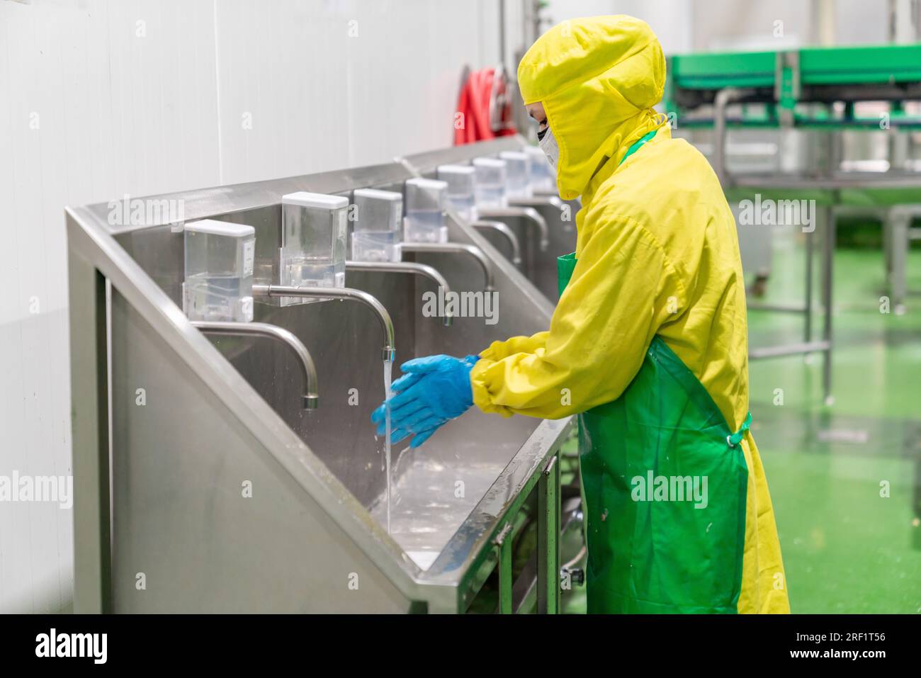 Worker washing hands with soap in food factory. Hand Hygiene and Food ...