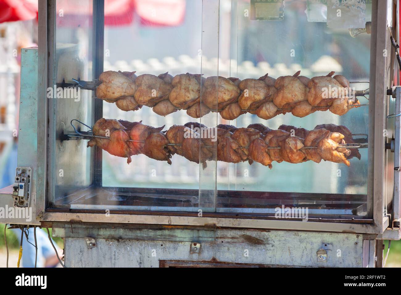 Grilled chicken on a spit. Fried chicken Stock Photo - Alamy