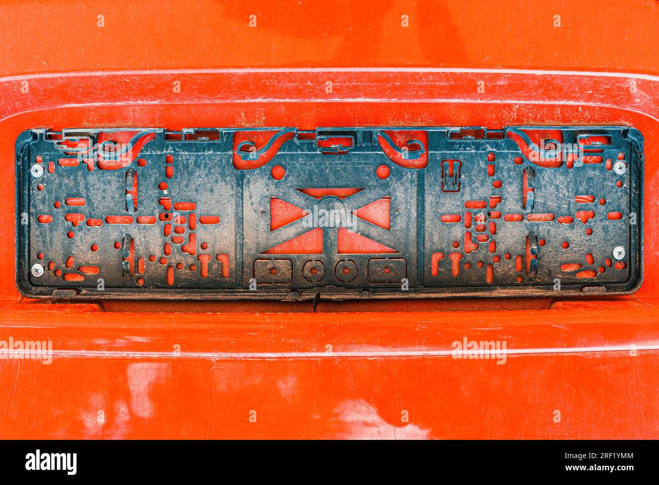 Car plastic license plate holder, old worn and dirty Stock Photo - Alamy