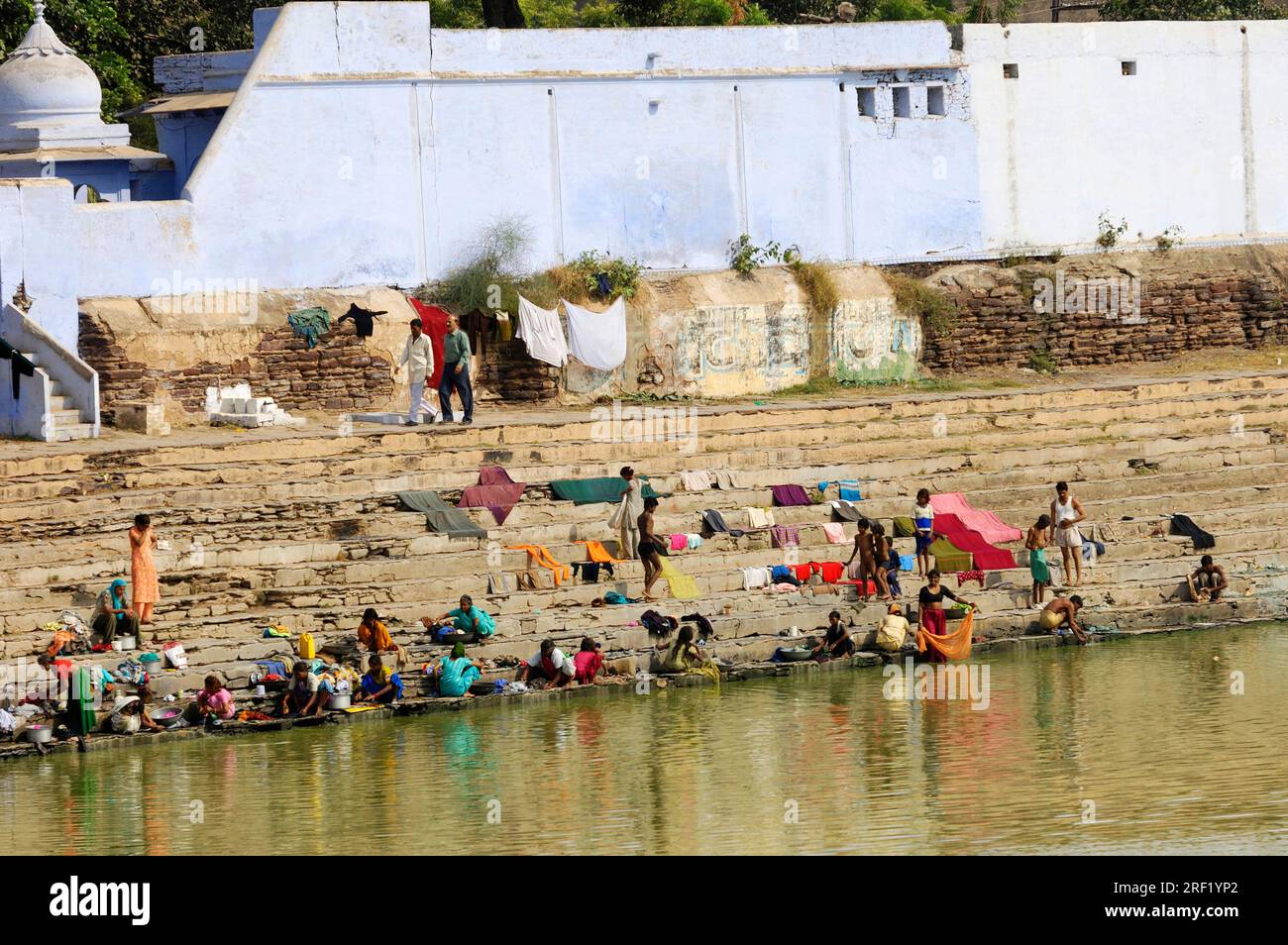 Women washing clothes in a pond, Deeg, Rajasthan, India Stock Photo - Alamy