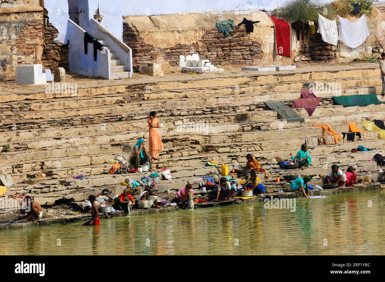 Women washing clothes in a pond, Deeg, Rajasthan, India Stock Photo - Alamy