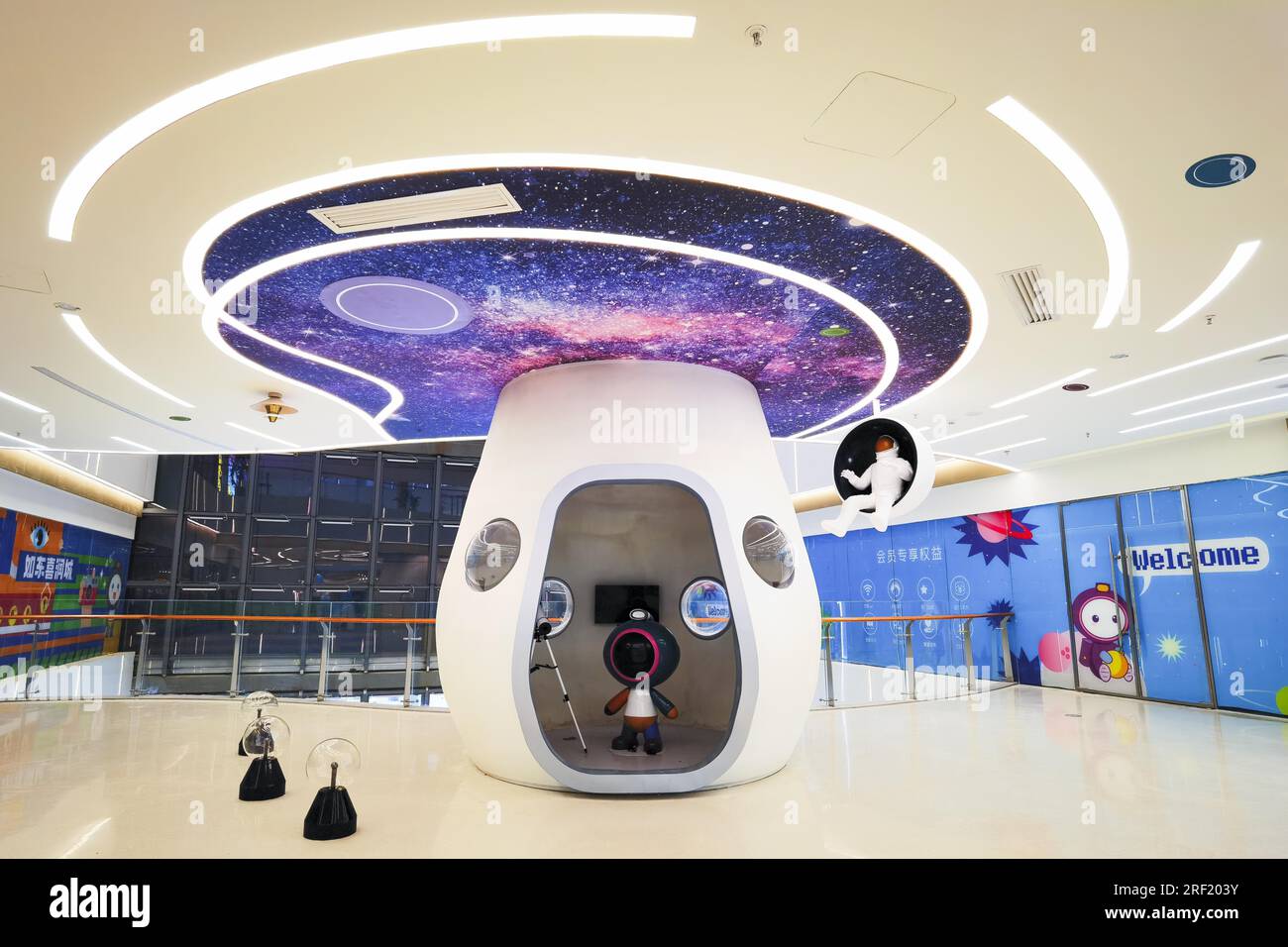 Visit a shopping mall with decorations in theme of the outer space in ...