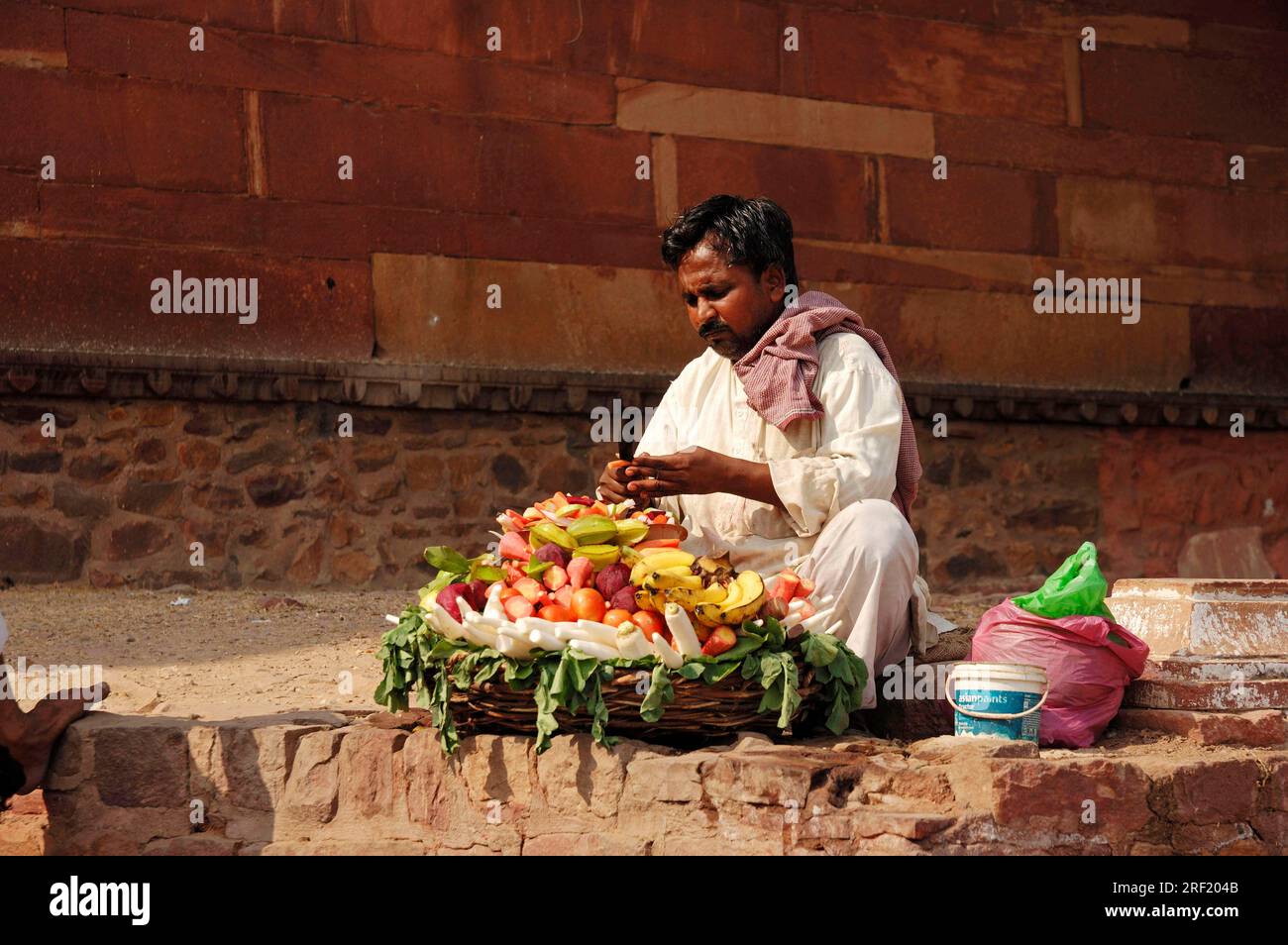 Fruit seller at the Jami Masjid Mosque, Dargah, Mughal town of Fatehpur ...