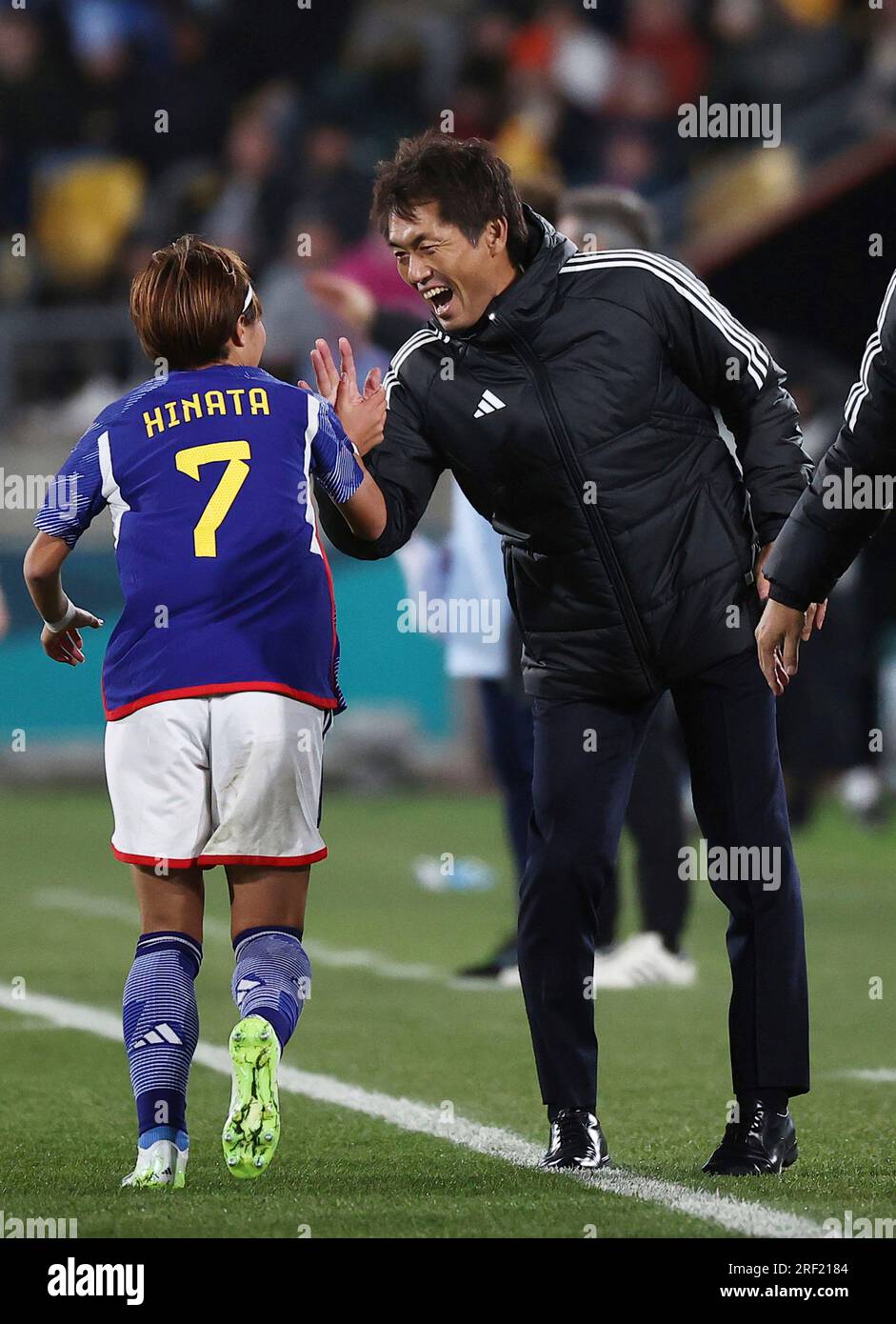 Japan's MIYAZAWA Hinata gives high-fives to the coach IKEDA Futoshi after scoring an opener ...