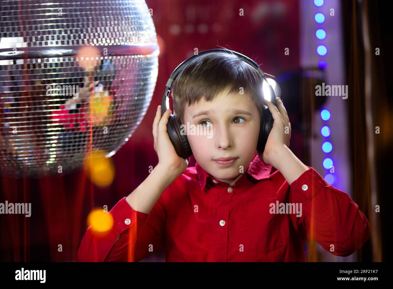 Boy listening to music night hi-res stock photography and images - Alamy