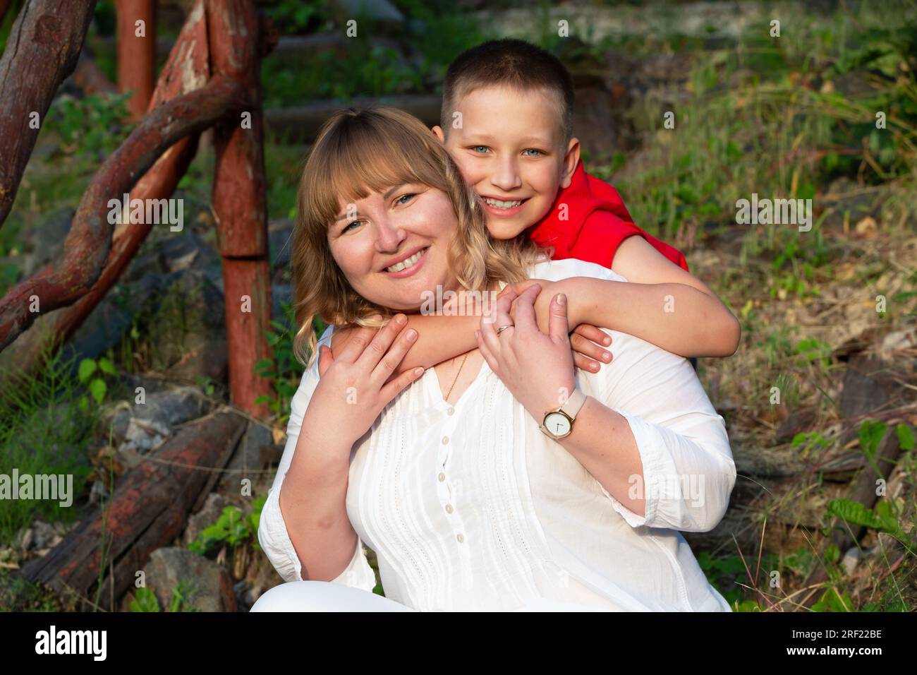 Happy mom and son on a summer walk laugh and look at the camera Stock ...