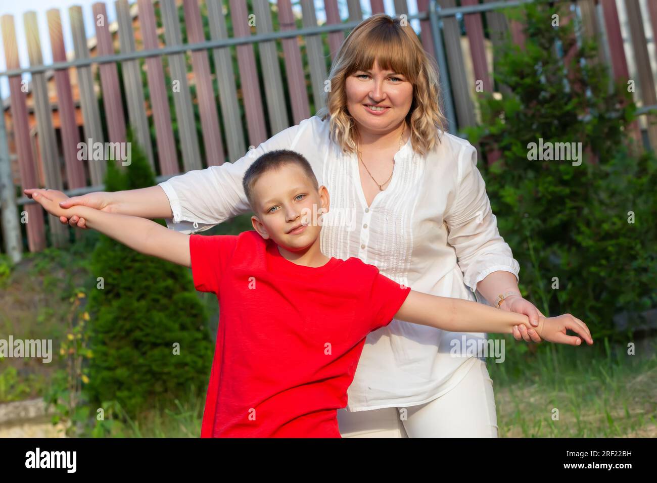 Happy mom and son on a summer walk laugh and play Stock Photo - Alamy