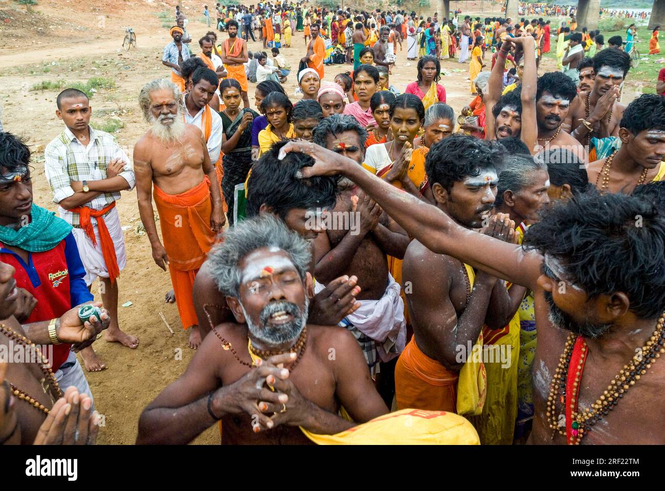 A man applying Sacred Ash to a God Possessed pilgrims during Vaikasi ...
