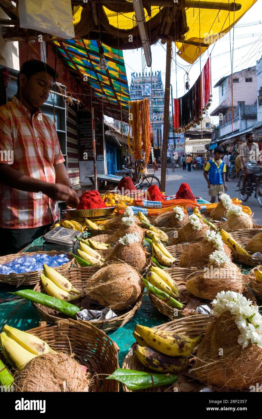 Coconuts, banana and pooja puja things in a shop at Swamimalai near ...
