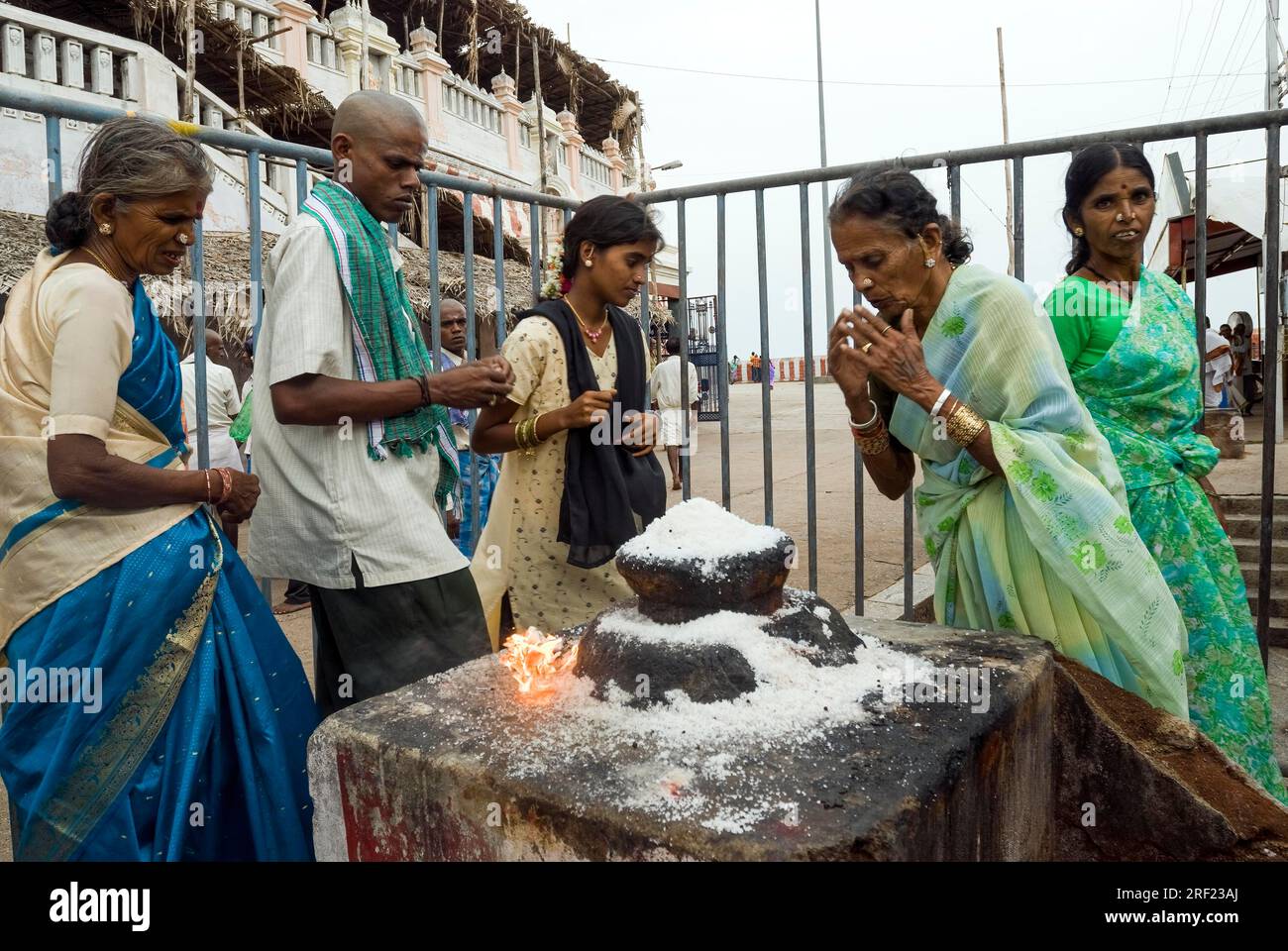 Devotees worshipping and offering salt in Lord Murugan Temple at ...