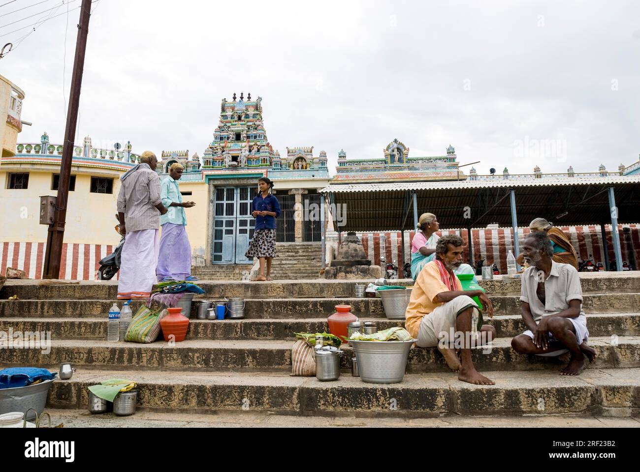 Women selling Idlies rice cake steps behind temple on morning hours in ...