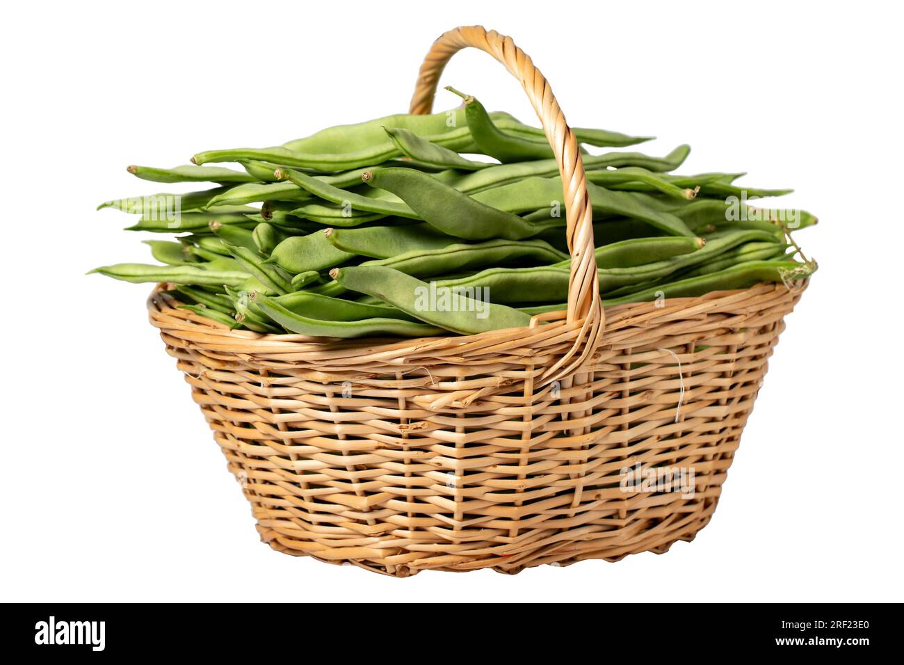 Fresh green beans in a wicker basket isolated on white background ...