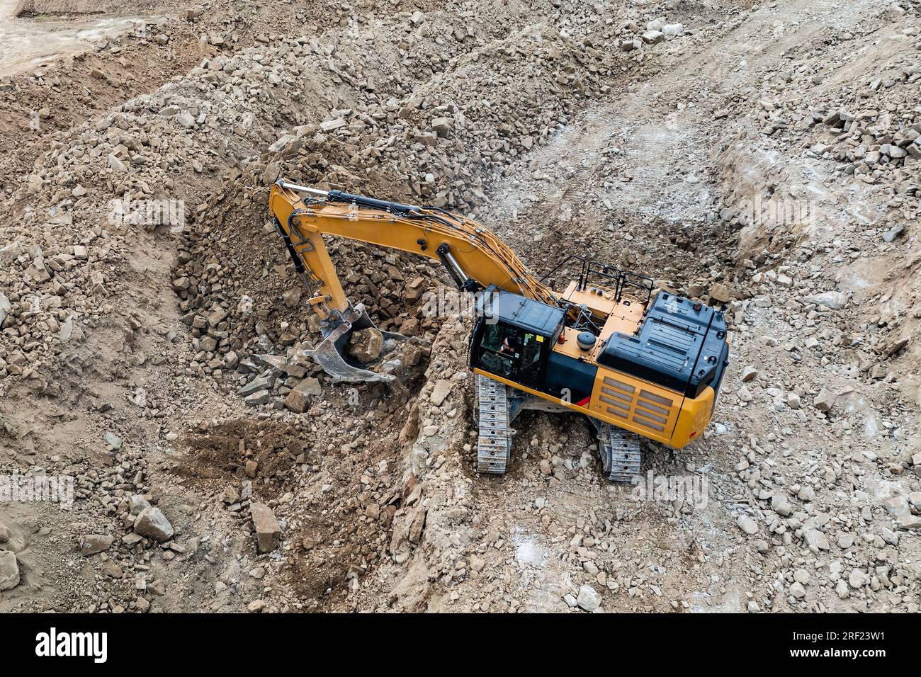 Aerial photo of an excavator working on road Stock Photo - Alamy