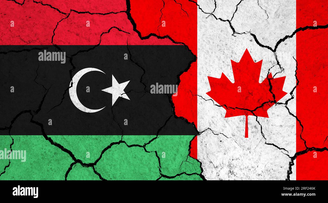 Flags of Libya and Canada on cracked surface - politics, relationship ...