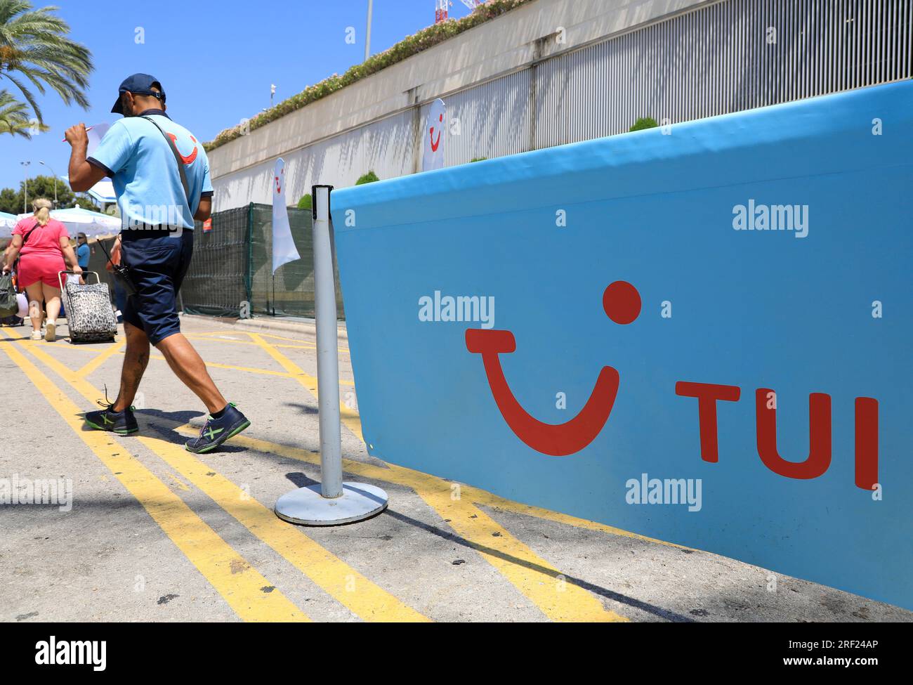 Palma, Spain. 30th July, 2023. A Tui employee stands at Mallorca ...