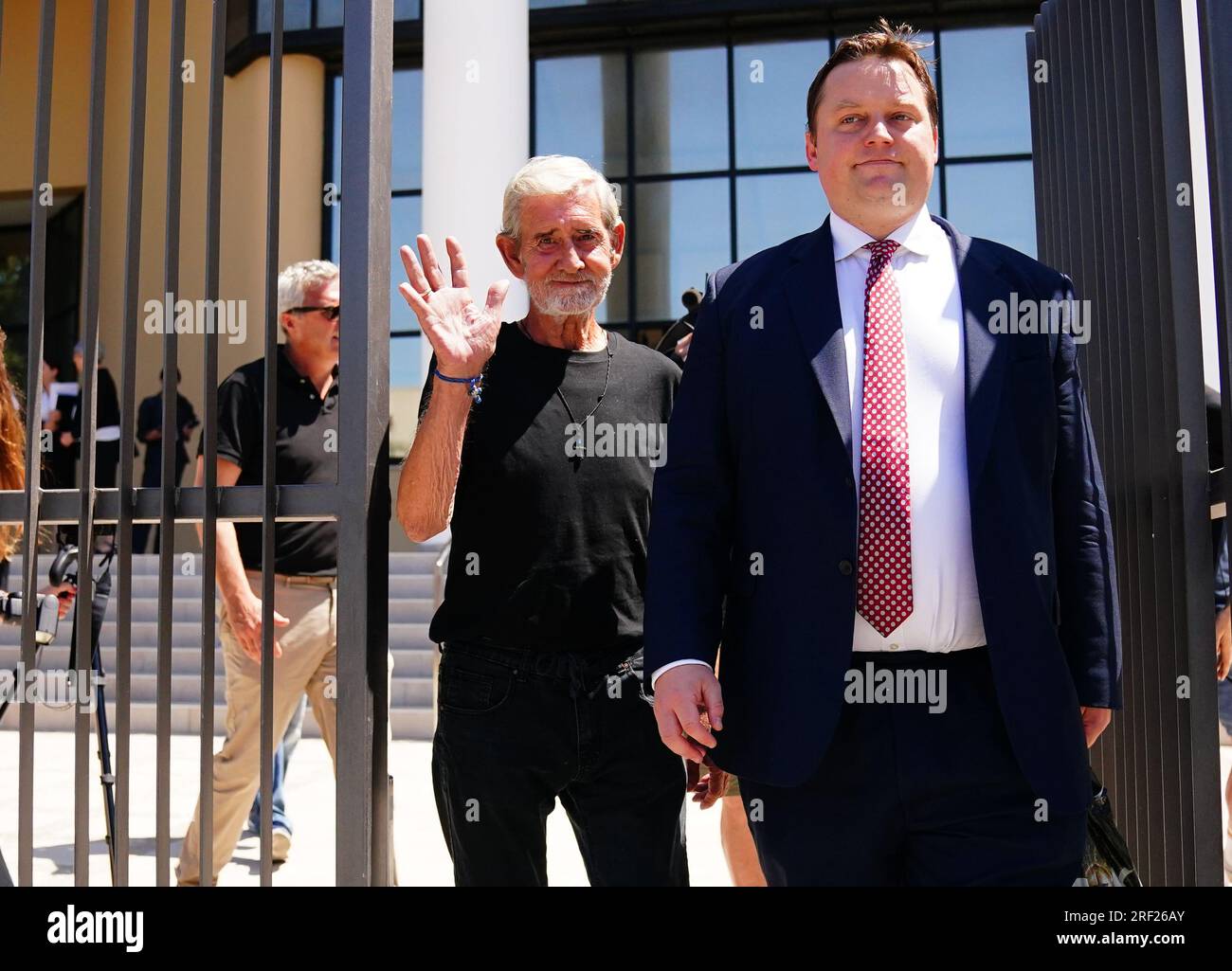 David Hunter (left) leaves Paphos District Court in Cyprus after he was ...