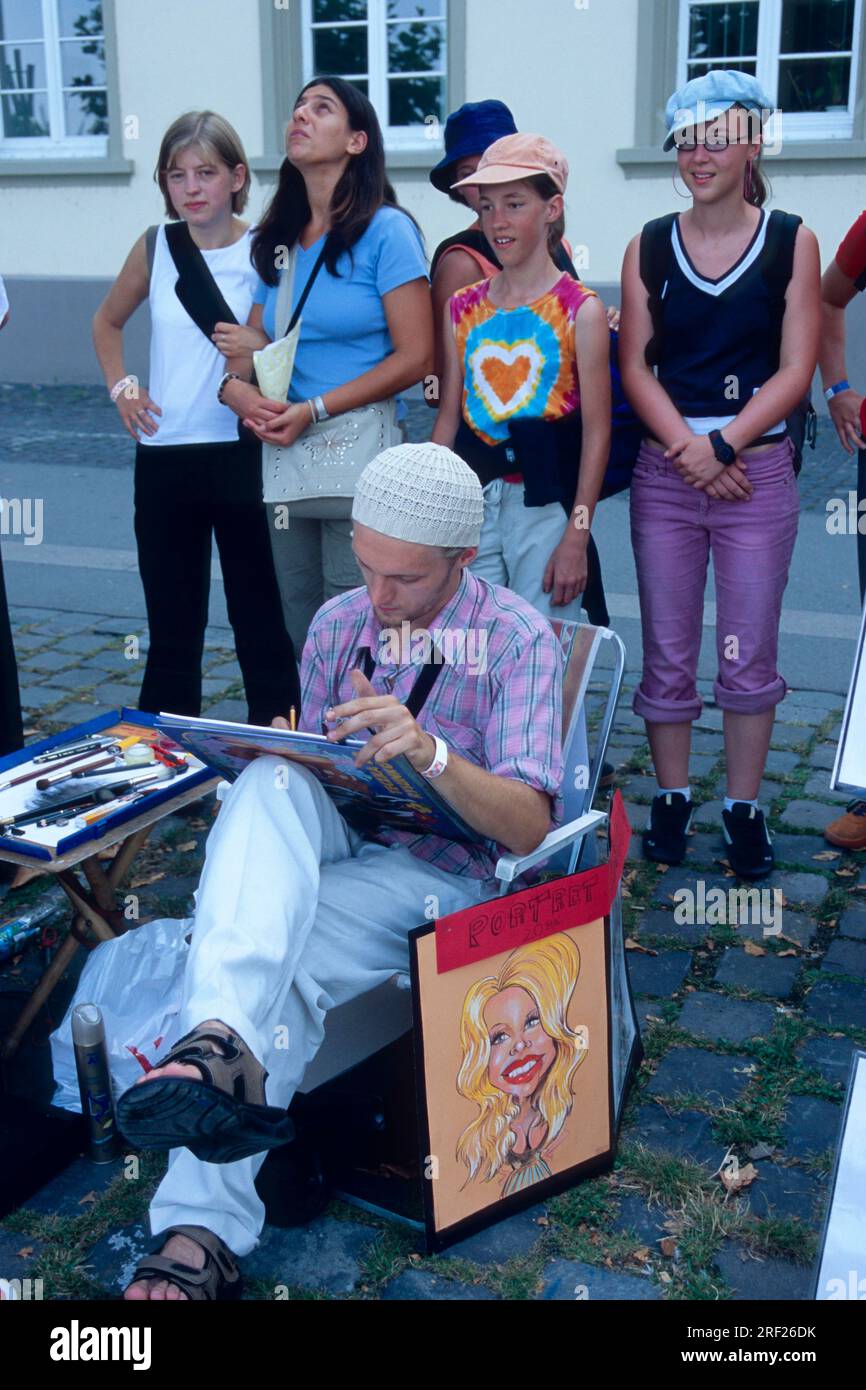 Street painter and spectator, Constance, Lake Constance, Baden ...