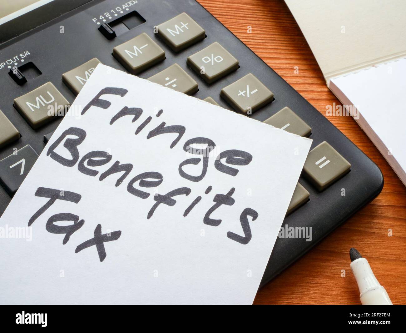 Fringe benefits tax on the calculator Stock Photo - Alamy