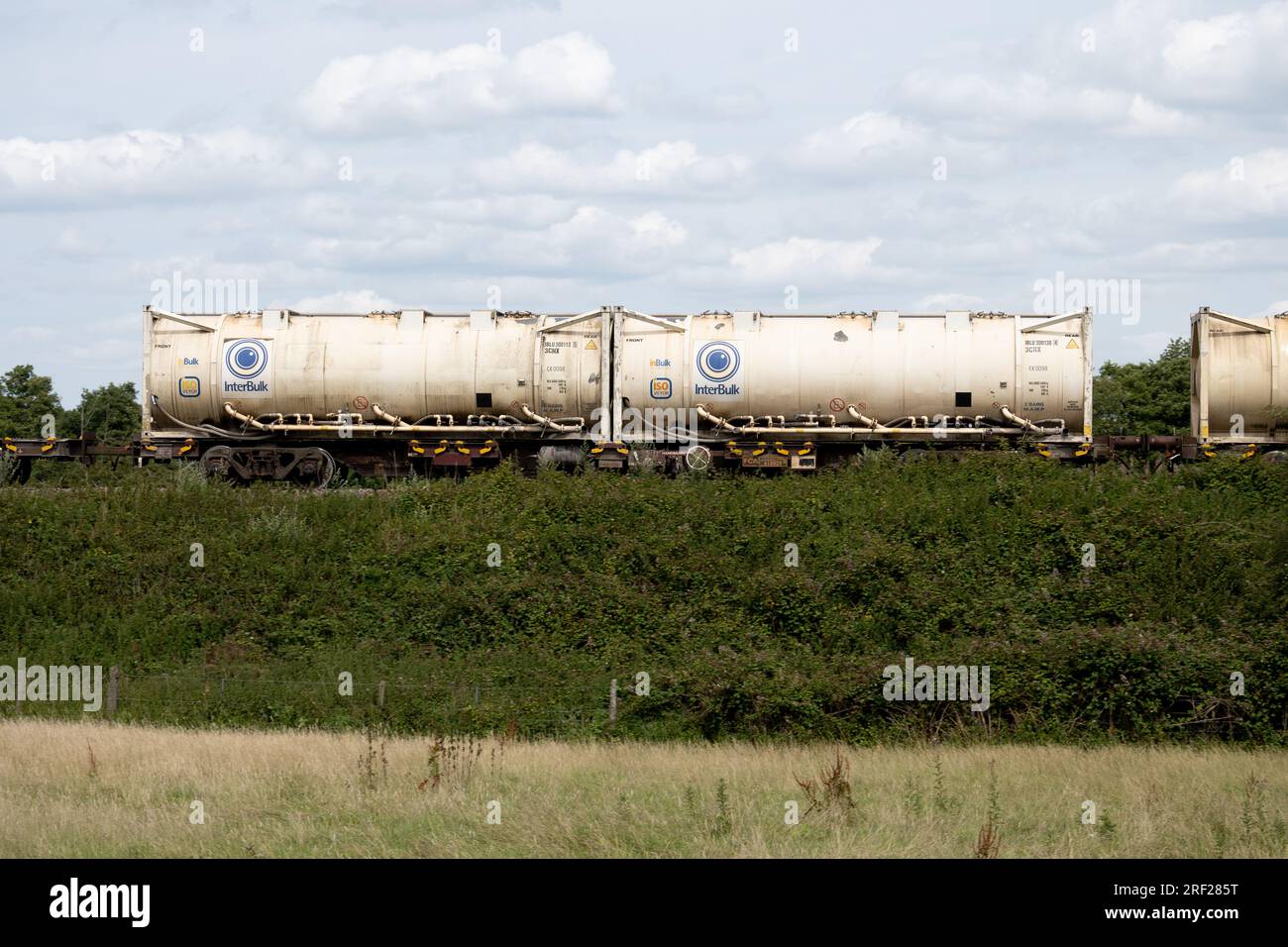InterBulk tanks on a train, Warwickshire, UK Stock Photo - Alamy
