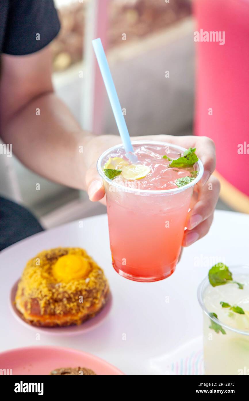Iced mocktails in a plastic cup in a restaurant environment Stock Photo ...