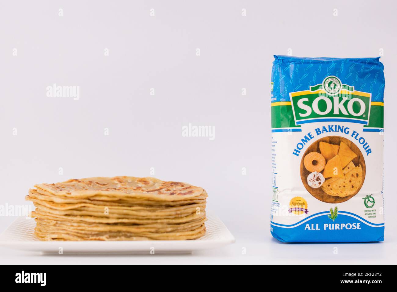 Chapati Mandazi Andazi Samosa triangular-shaped snacks on a plate on a ...