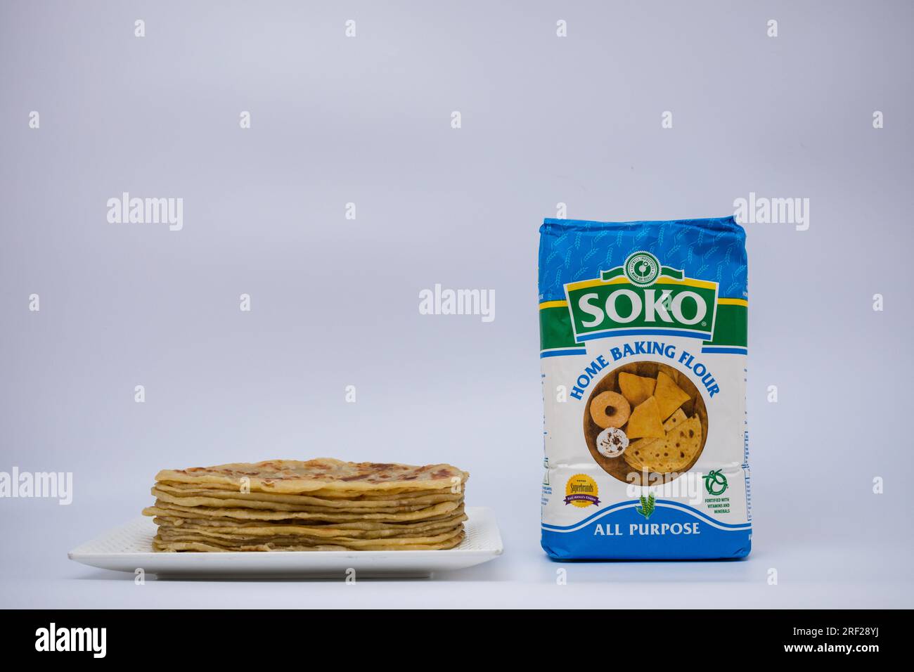 Chapati Mandazi Andazi Samosa triangular-shaped snacks on a plate on a ...