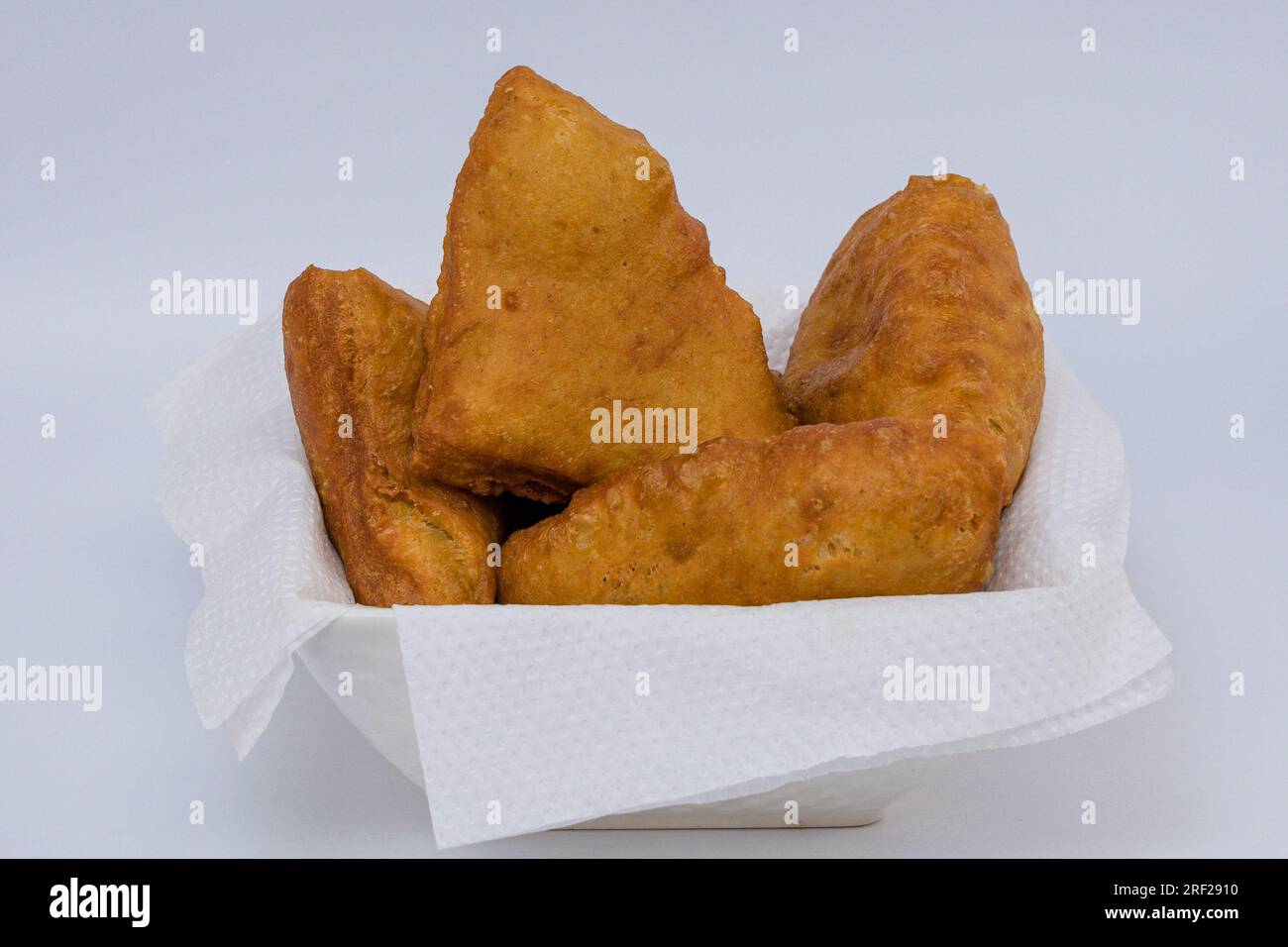 Chapati Mandazi Andazi Samosa triangular-shaped snacks on a plate on a ...