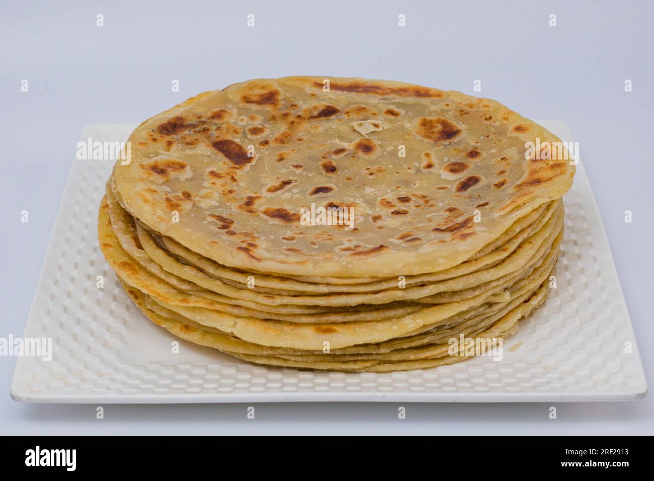 Chapati Mandazi Andazi Samosa triangular-shaped snacks on a plate on a ...