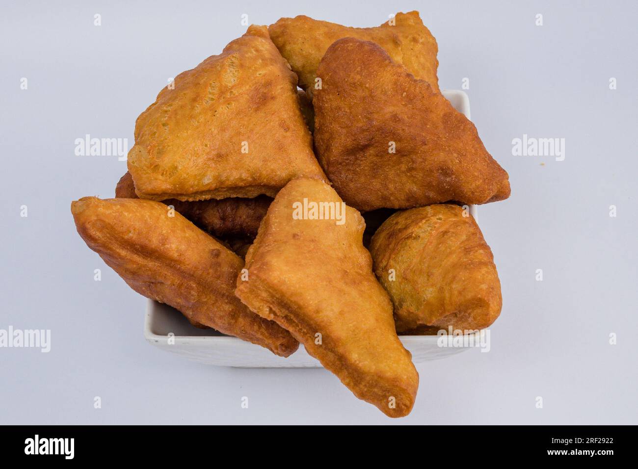 Chapati Mandazi Andazi Samosa triangular-shaped snacks on a plate on a ...