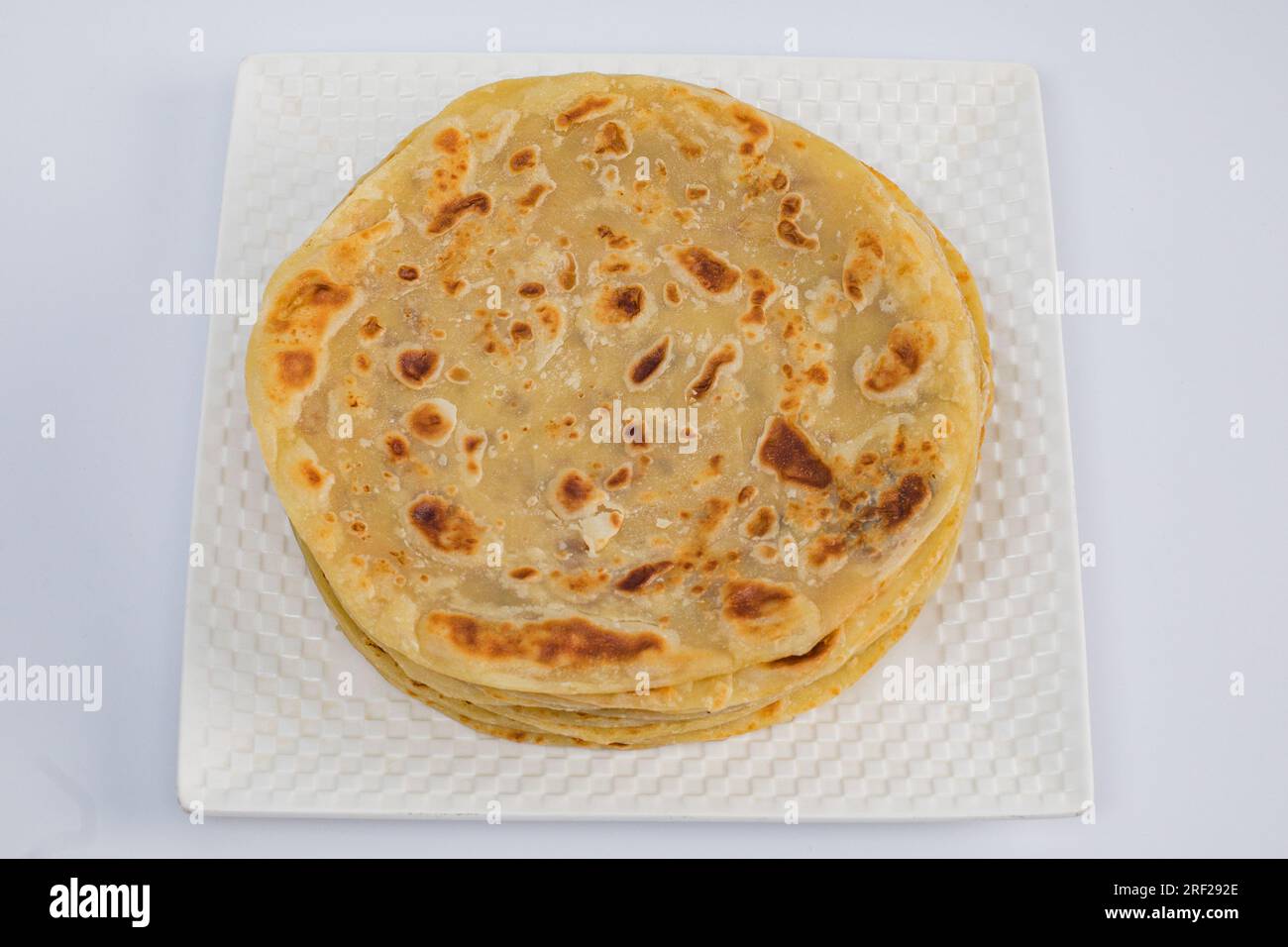 Chapati Mandazi Andazi Samosa triangular-shaped snacks on a plate on a ...