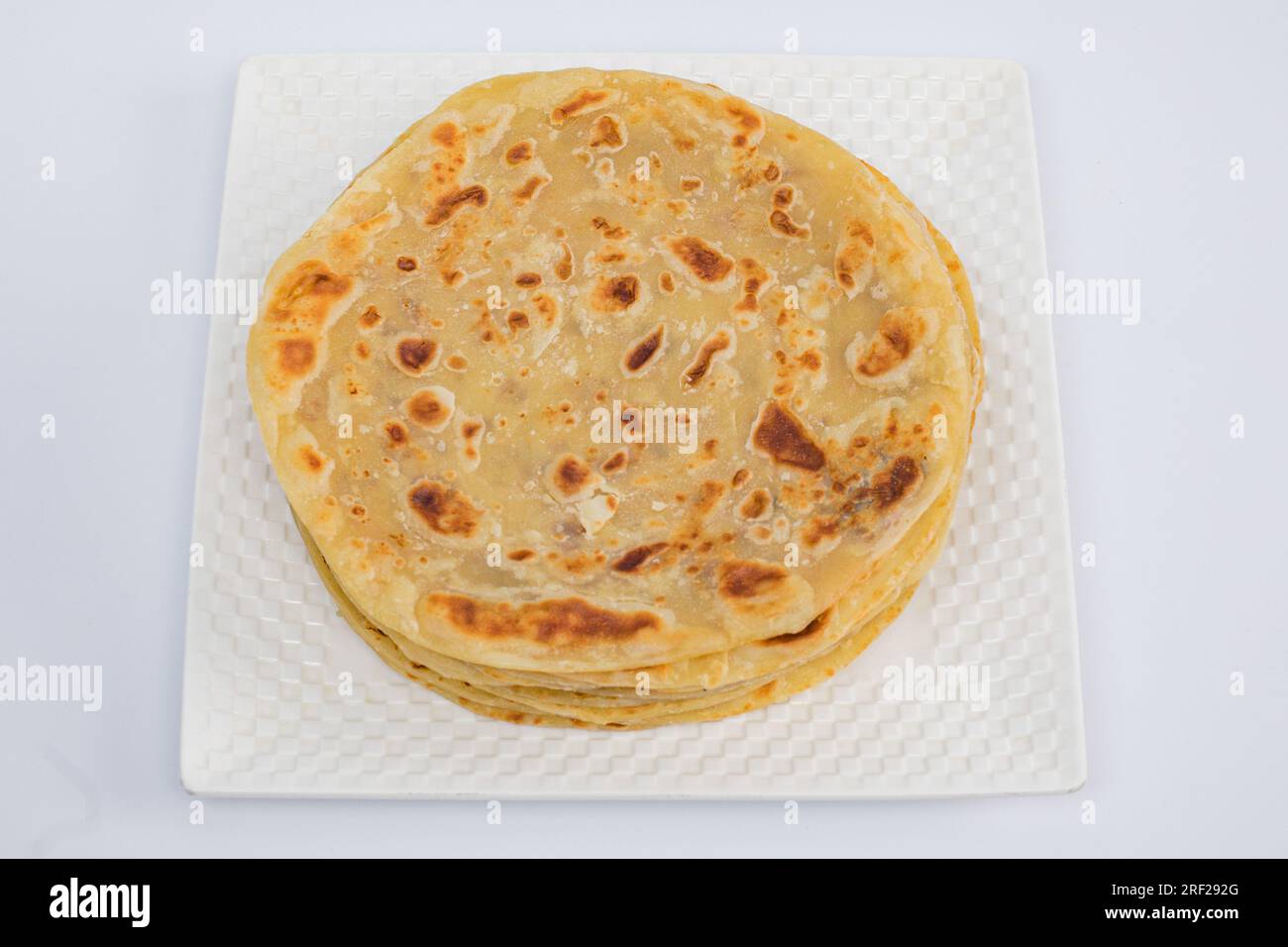 Chapati Mandazi Andazi Samosa triangular-shaped snacks on a plate on a ...