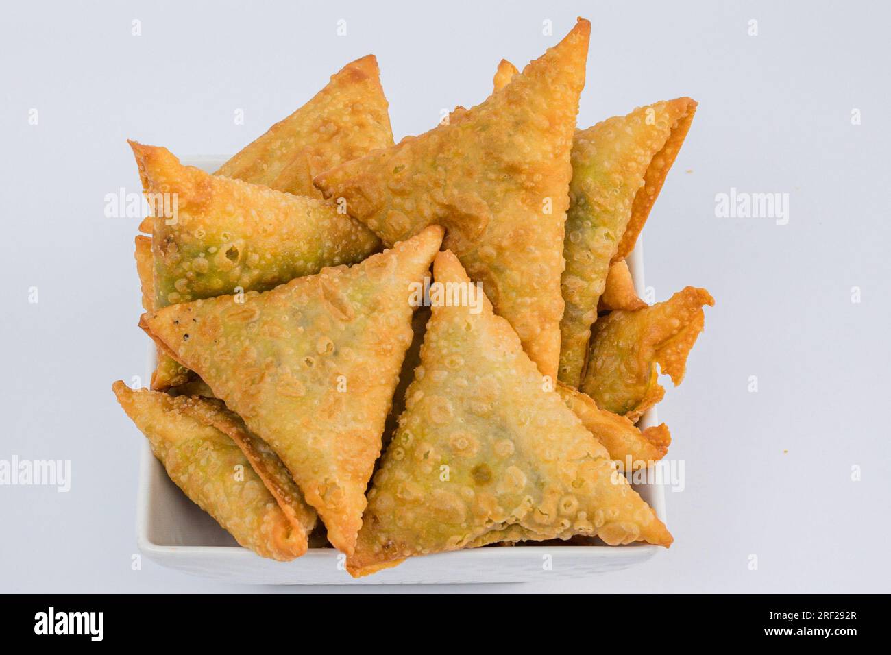Chapati Mandazi Andazi Samosa triangular-shaped snacks on a plate on a ...