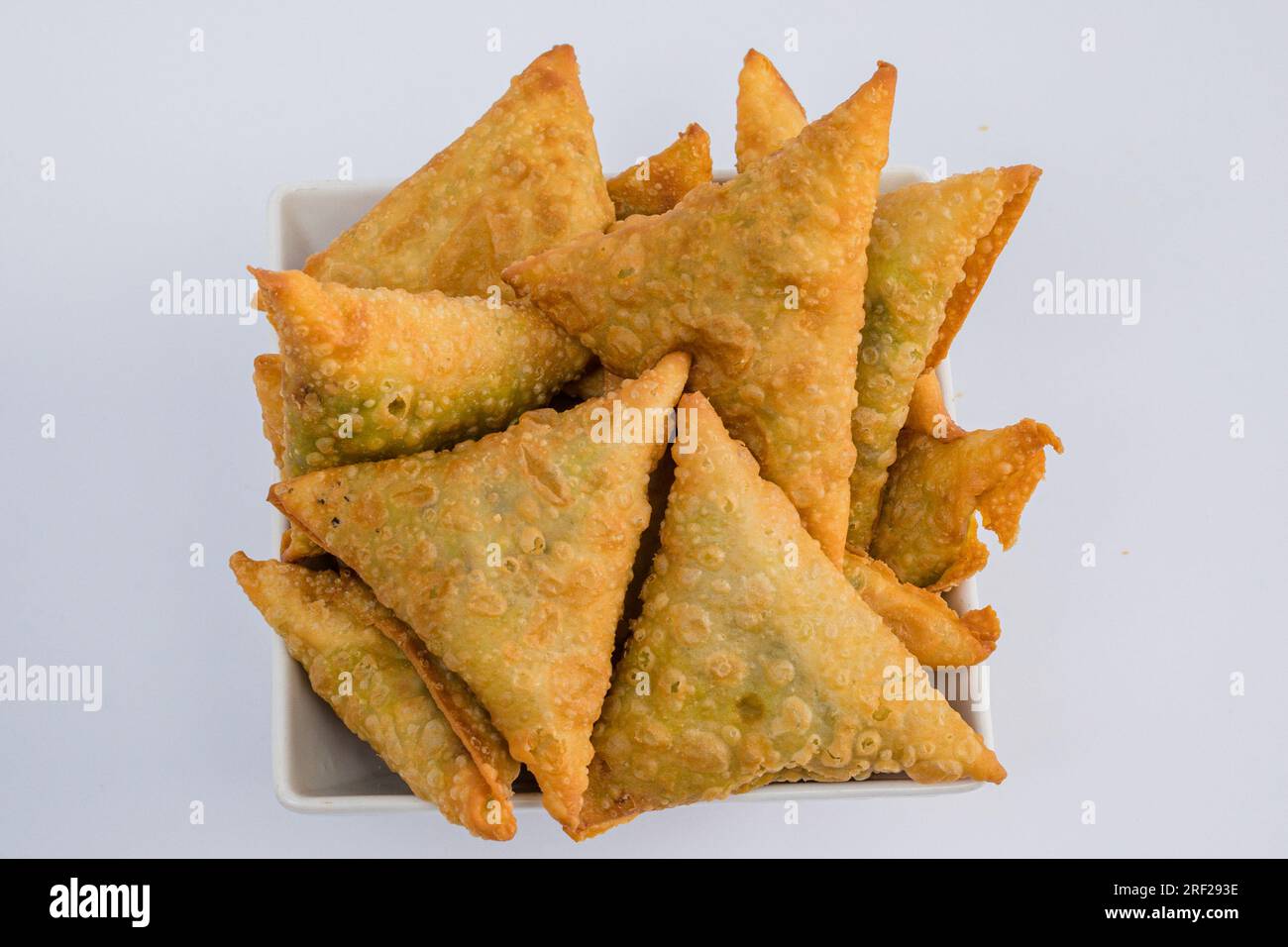 Chapati Mandazi Andazi Samosa triangular-shaped snacks on a plate on a ...
