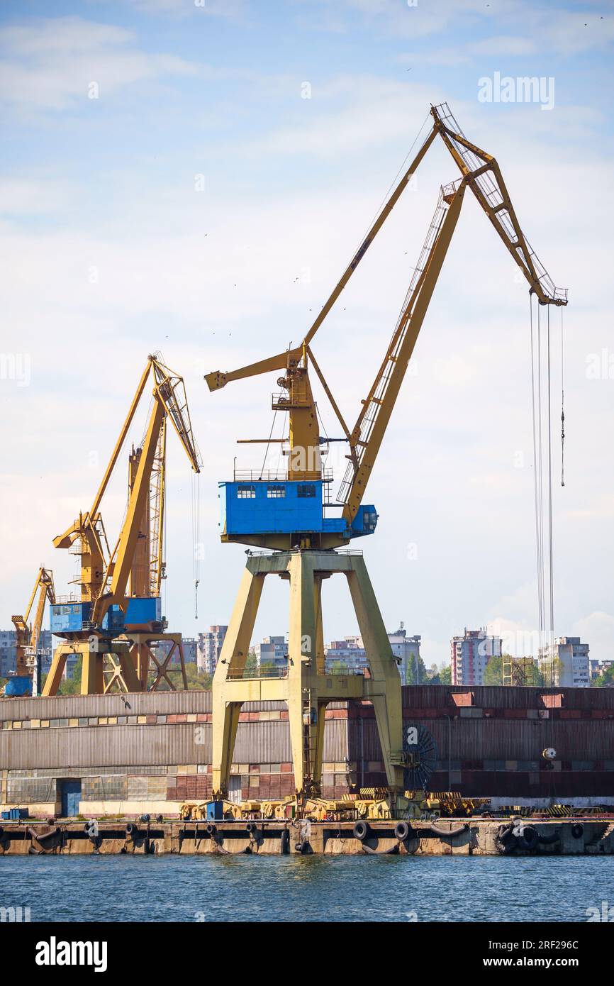 Container terminal, with cranes, in a commercial port Stock Photo - Alamy