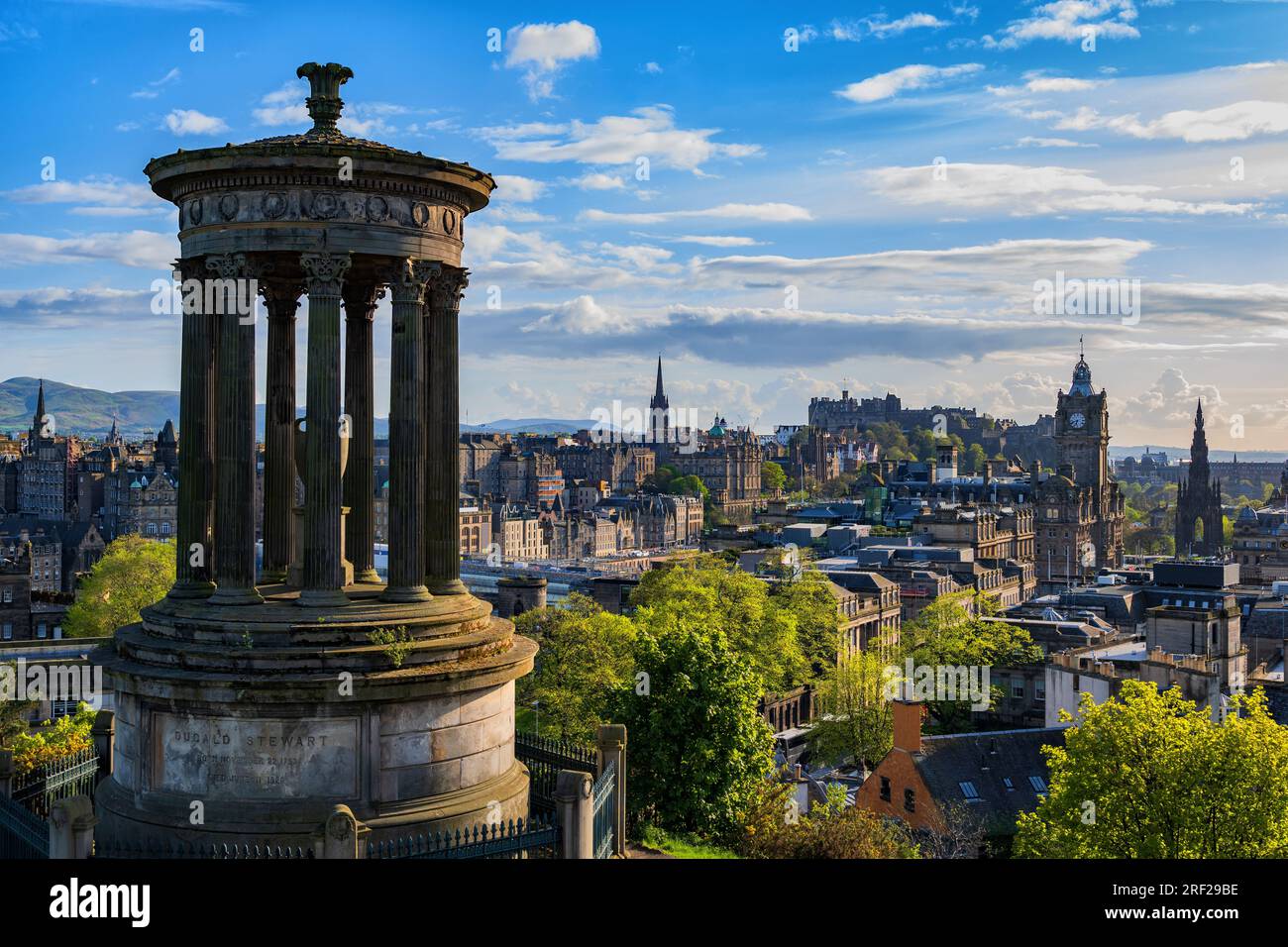 Edinburgh city skyline with Dugald Stewart Monument on Calton Hill in ...