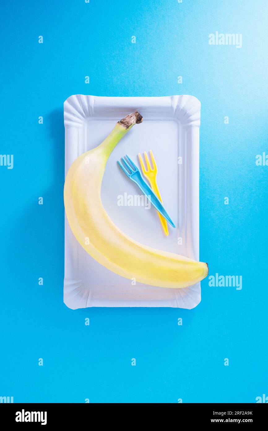 Paper banana on blue hi-res stock photography and images - Alamy