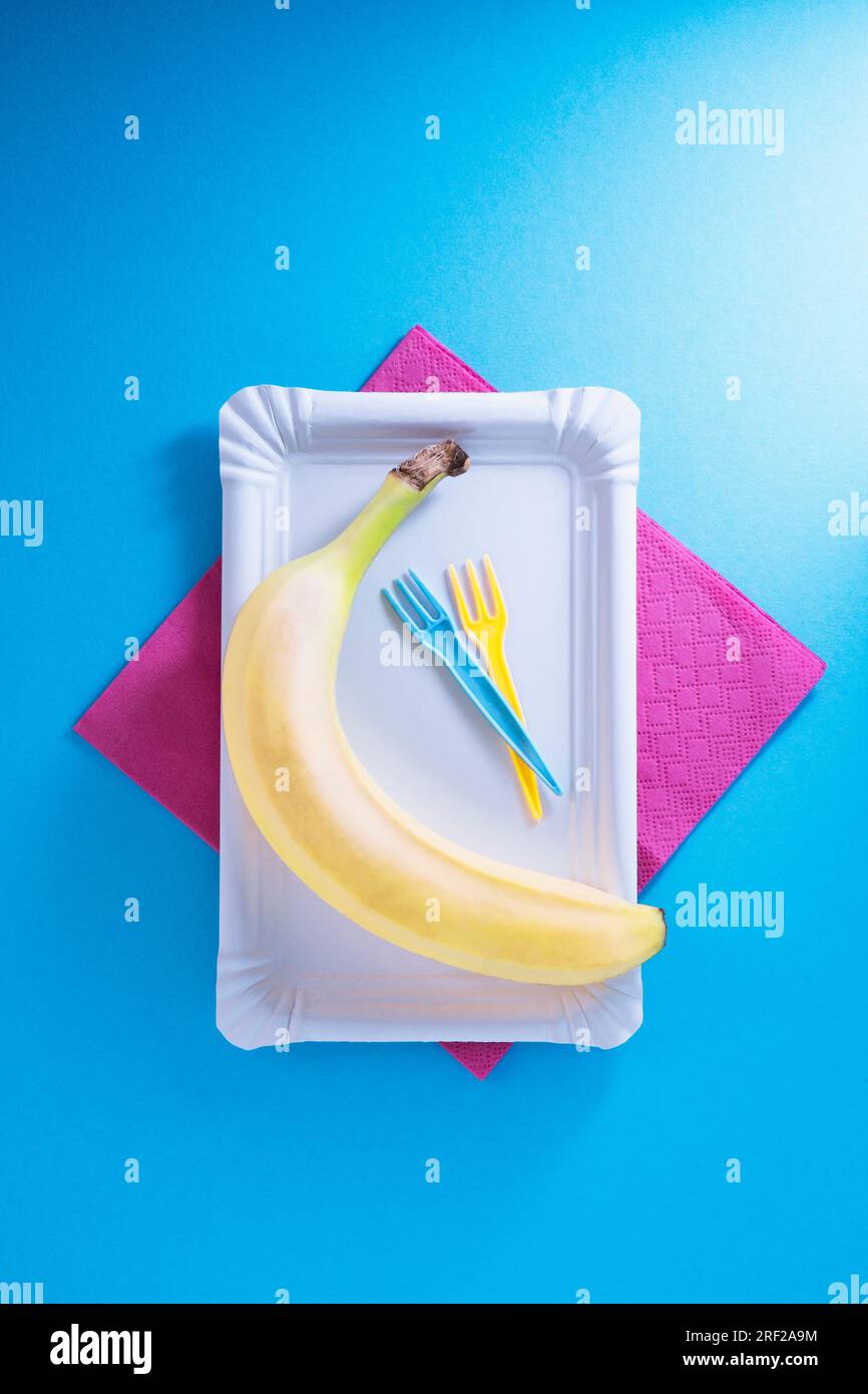 Paper banana on blue hi-res stock photography and images - Alamy