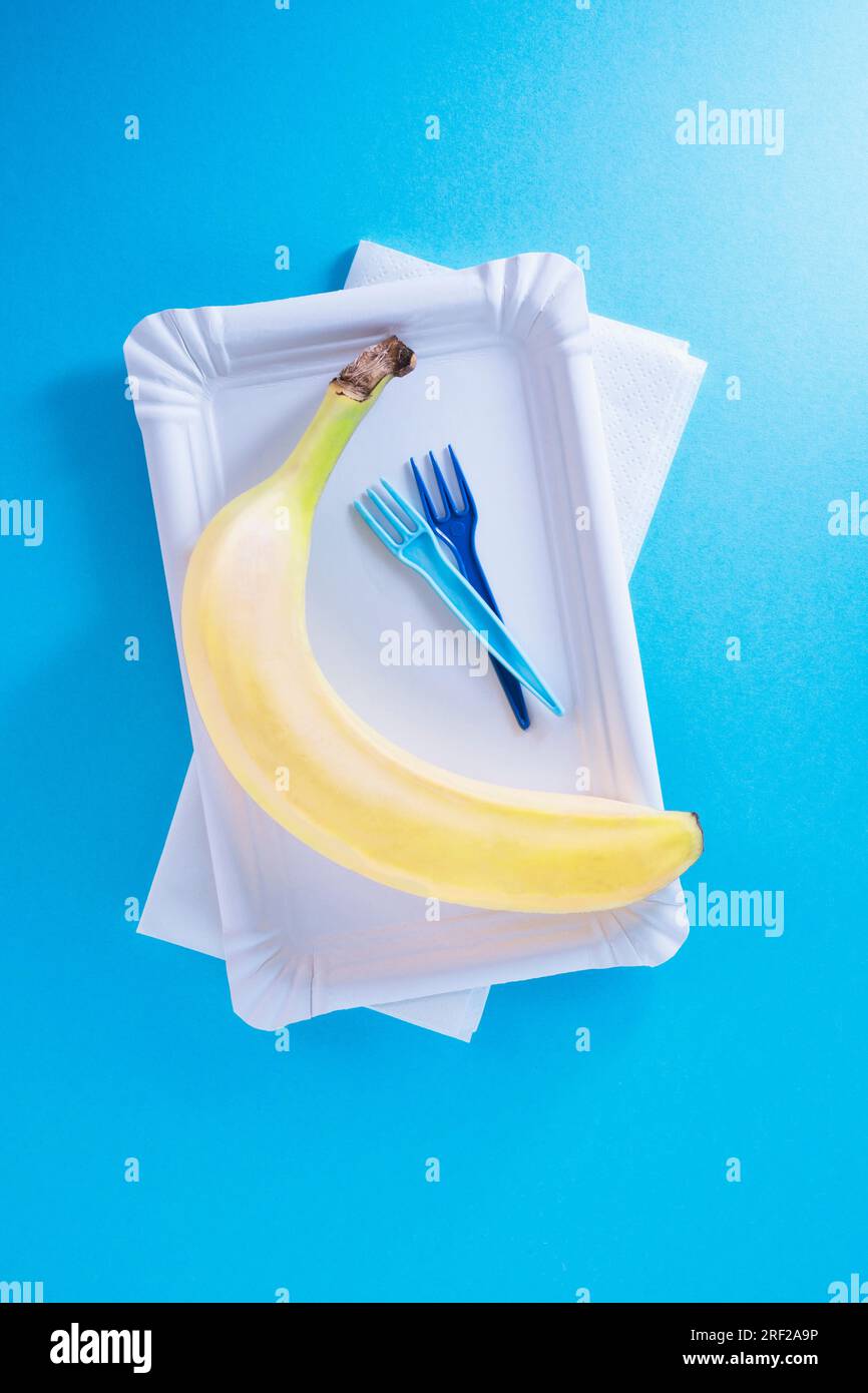 Paper banana on blue hi-res stock photography and images - Alamy