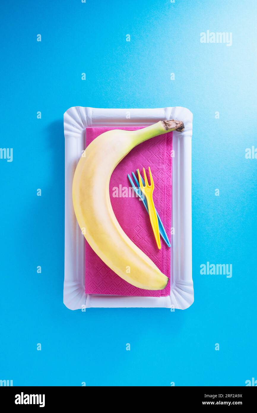 Paper banana on blue hi-res stock photography and images - Alamy