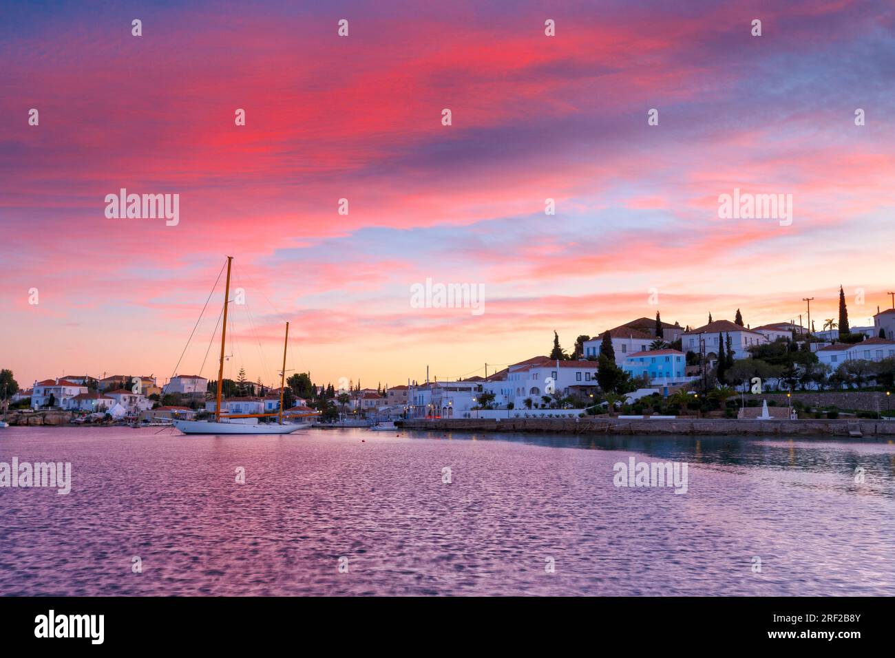 Yacht in the harbour of Spetses village, Greece Stock Photo - Alamy